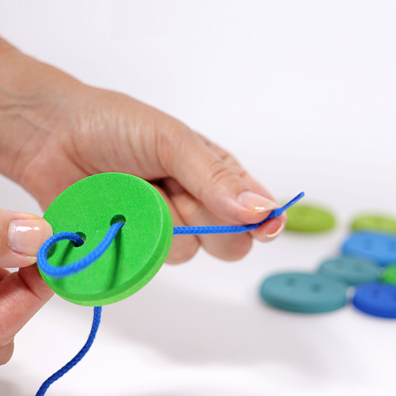 Threading game large wooden buttons
